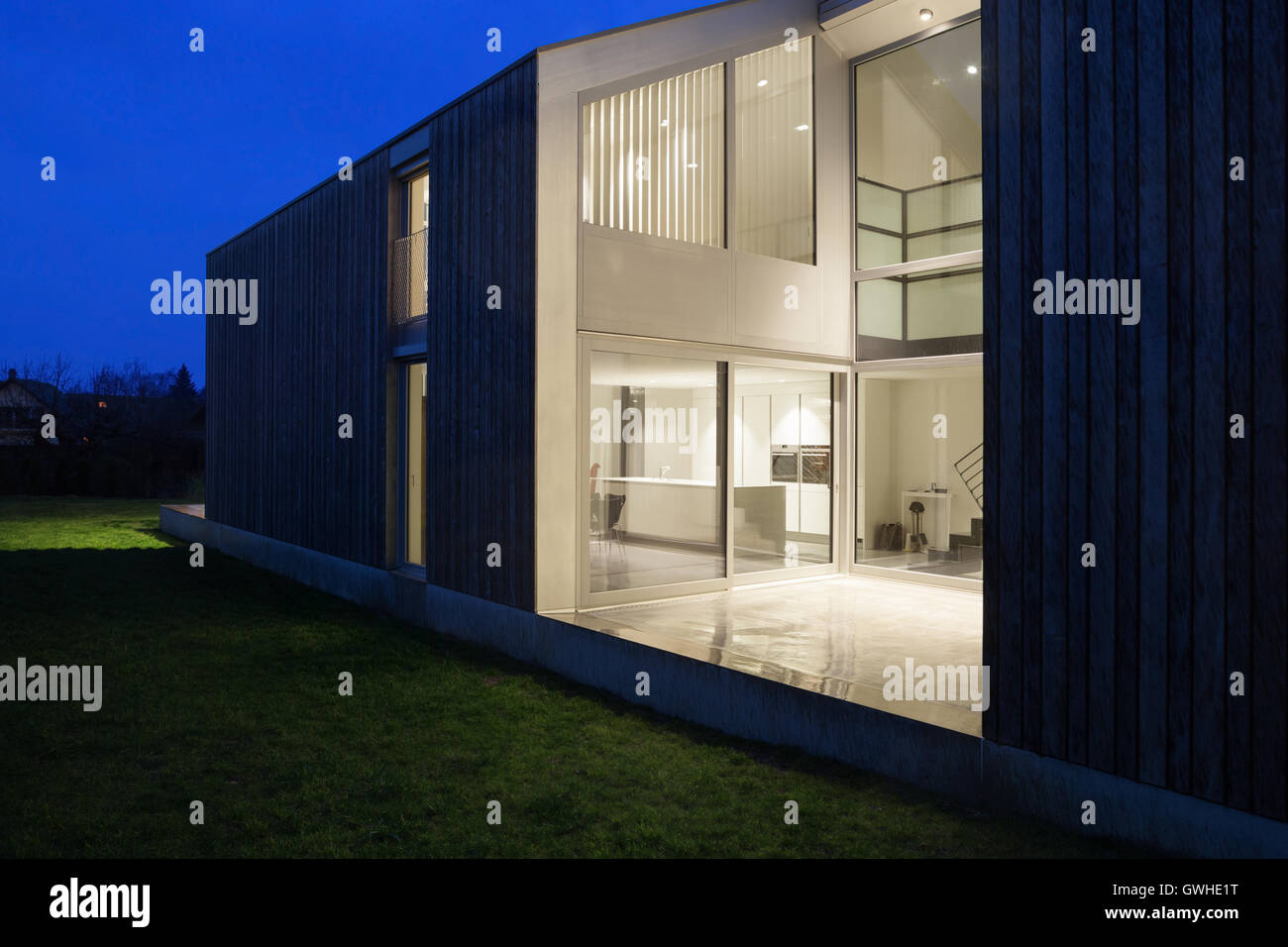 Exterior of a modern house, night scene Stock Photo - Alamy
