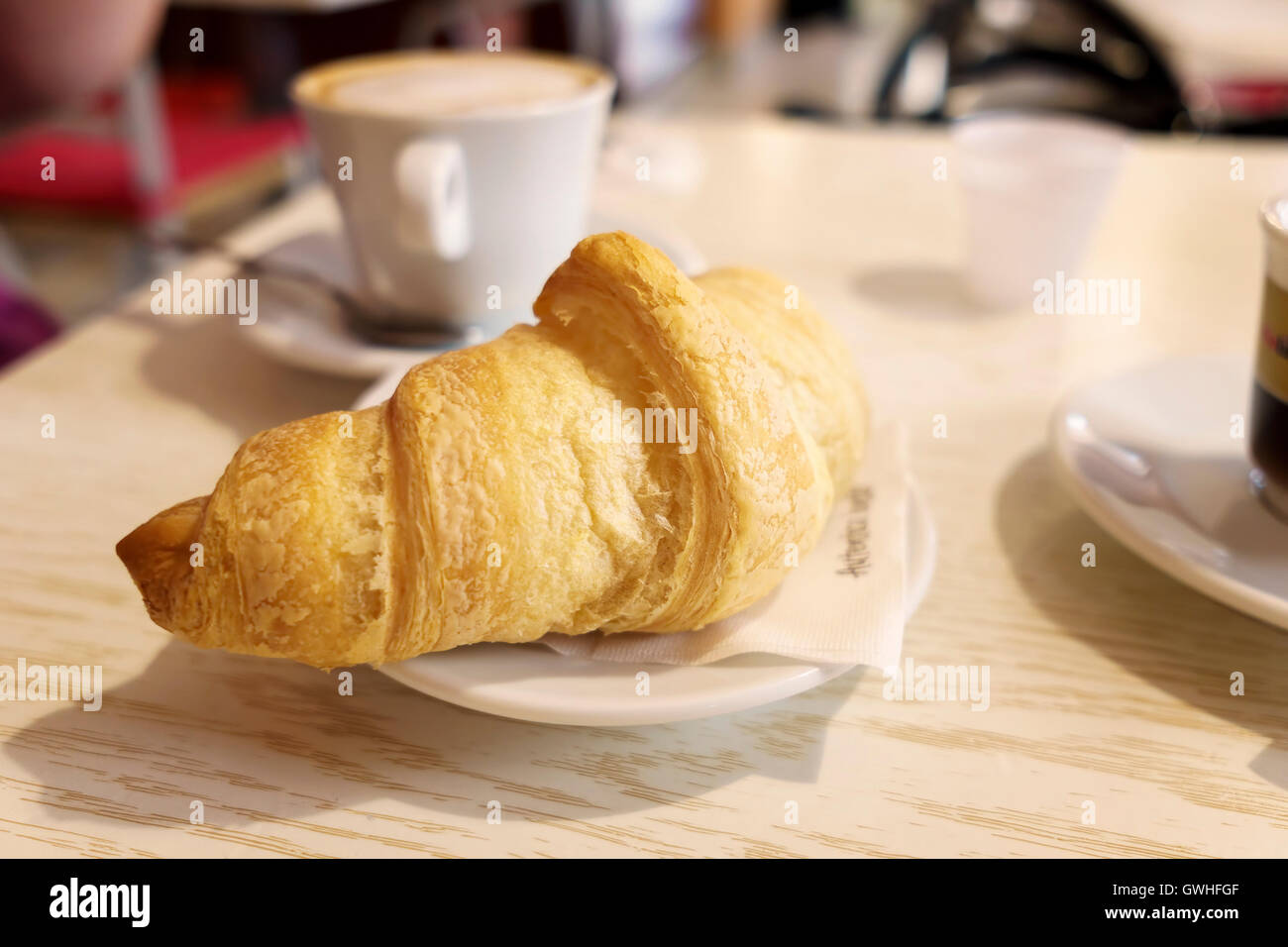 croissants and cappuccino on the table in a cafe Stock Photo - Alamy
