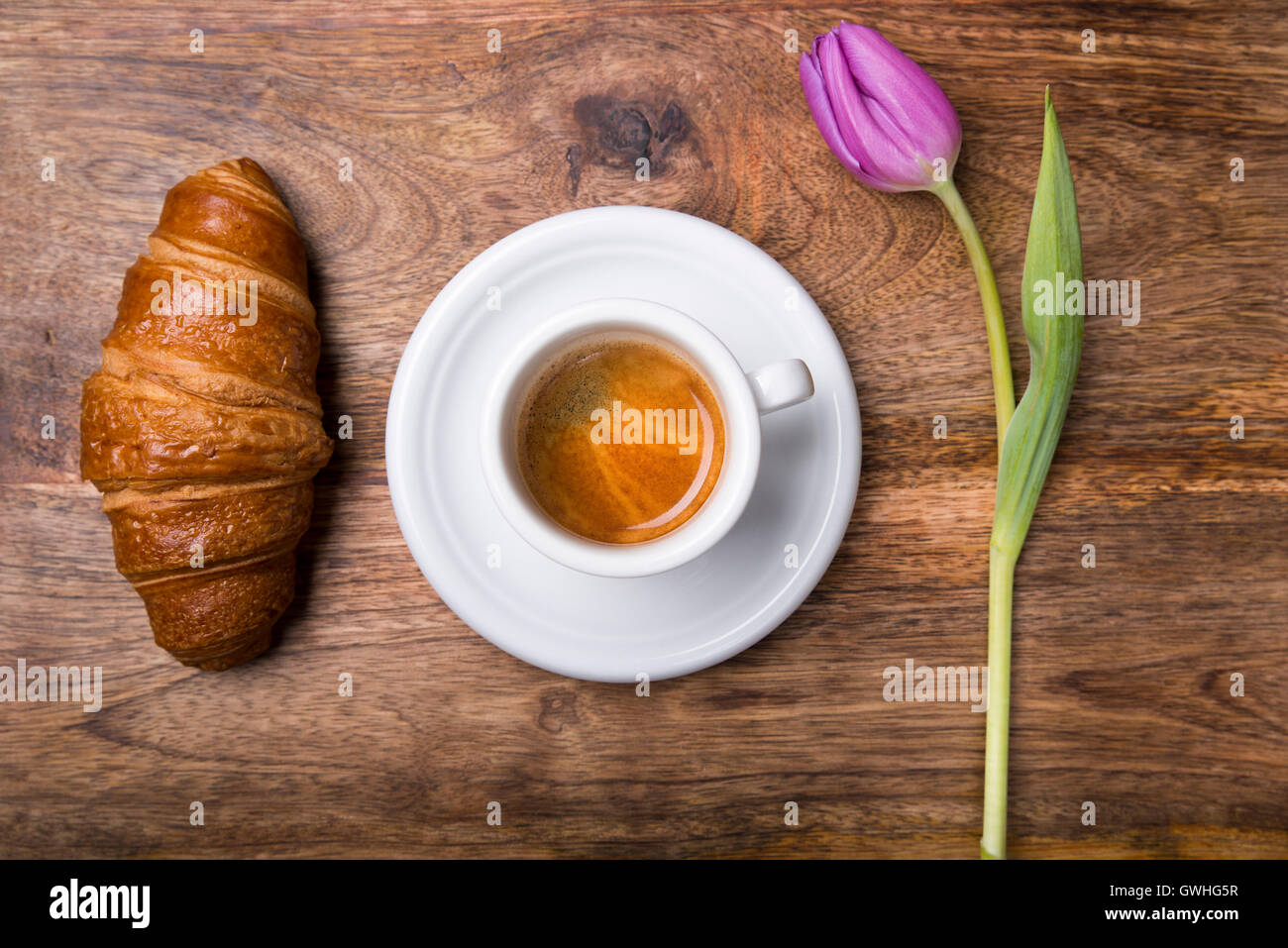 coffee, croissant and purple tulip for spring breakfast Stock Photo - Alamy