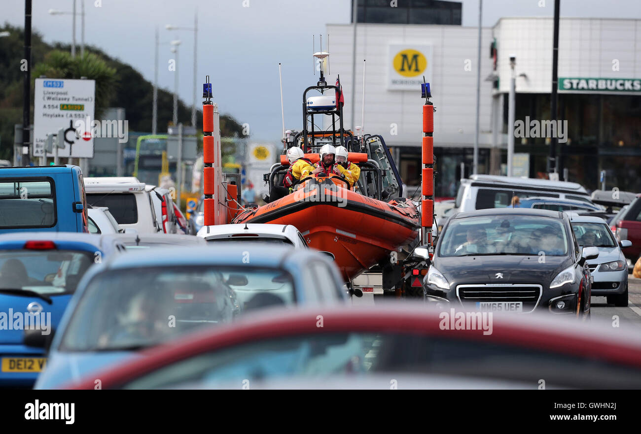 The RNLI travel along a road as they return back to their base in New ...