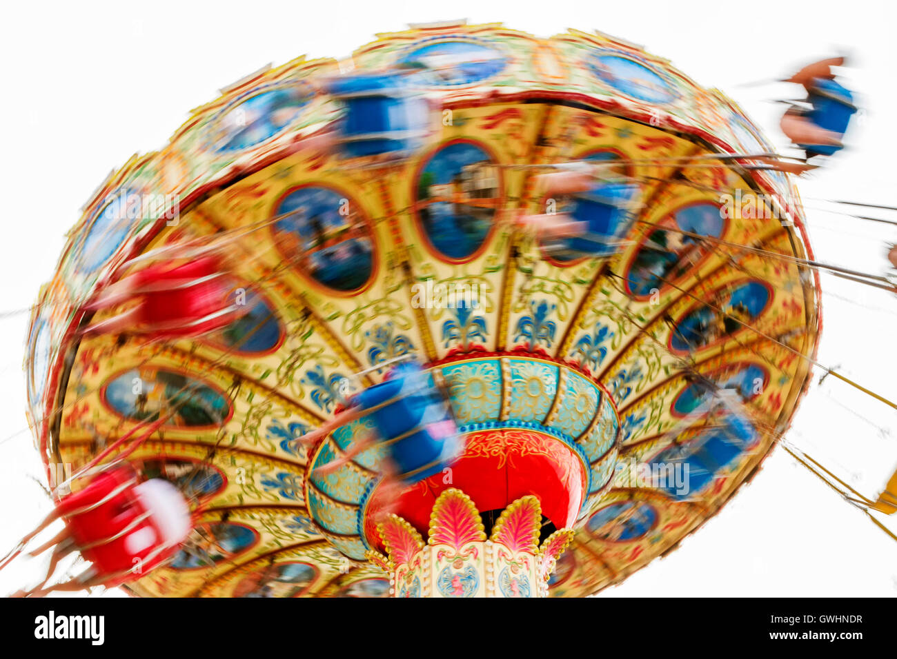 Children riding a colorful merry-go-round at the county fair Stock ...