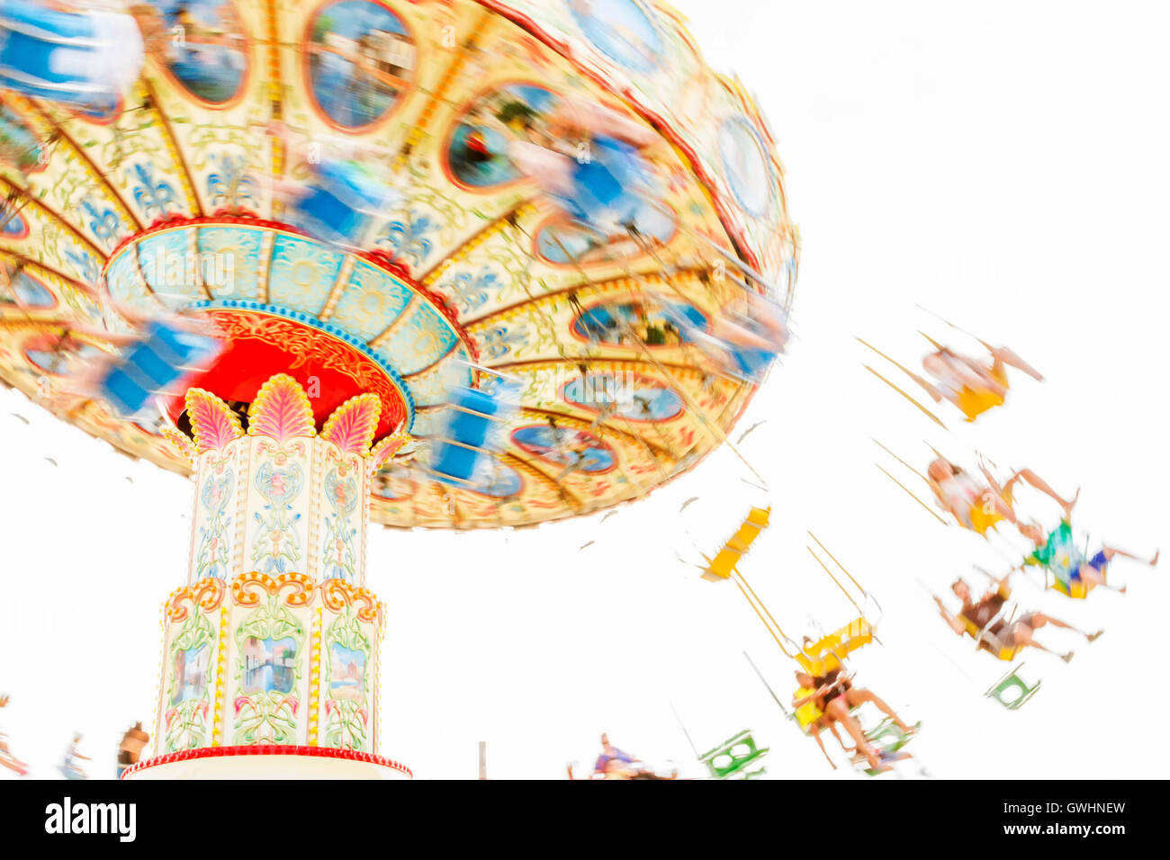 Children riding a colorful merry-go-round at the county fair Stock ...