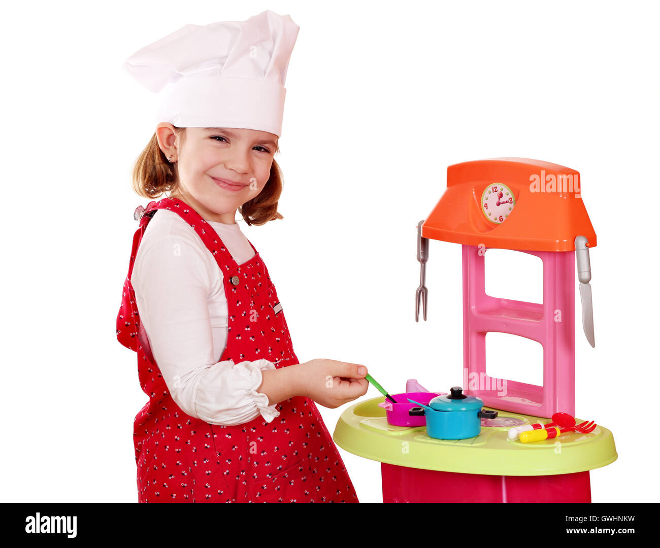 beautiful little girl play cooking Stock Photo - Alamy