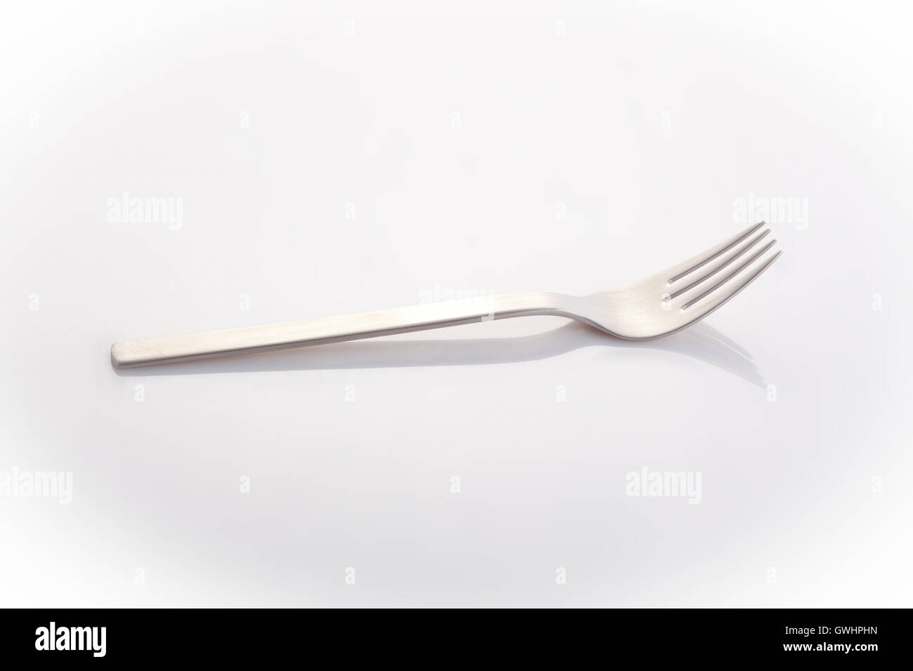 stainless fork isolated on a white background Stock Photo - Alamy