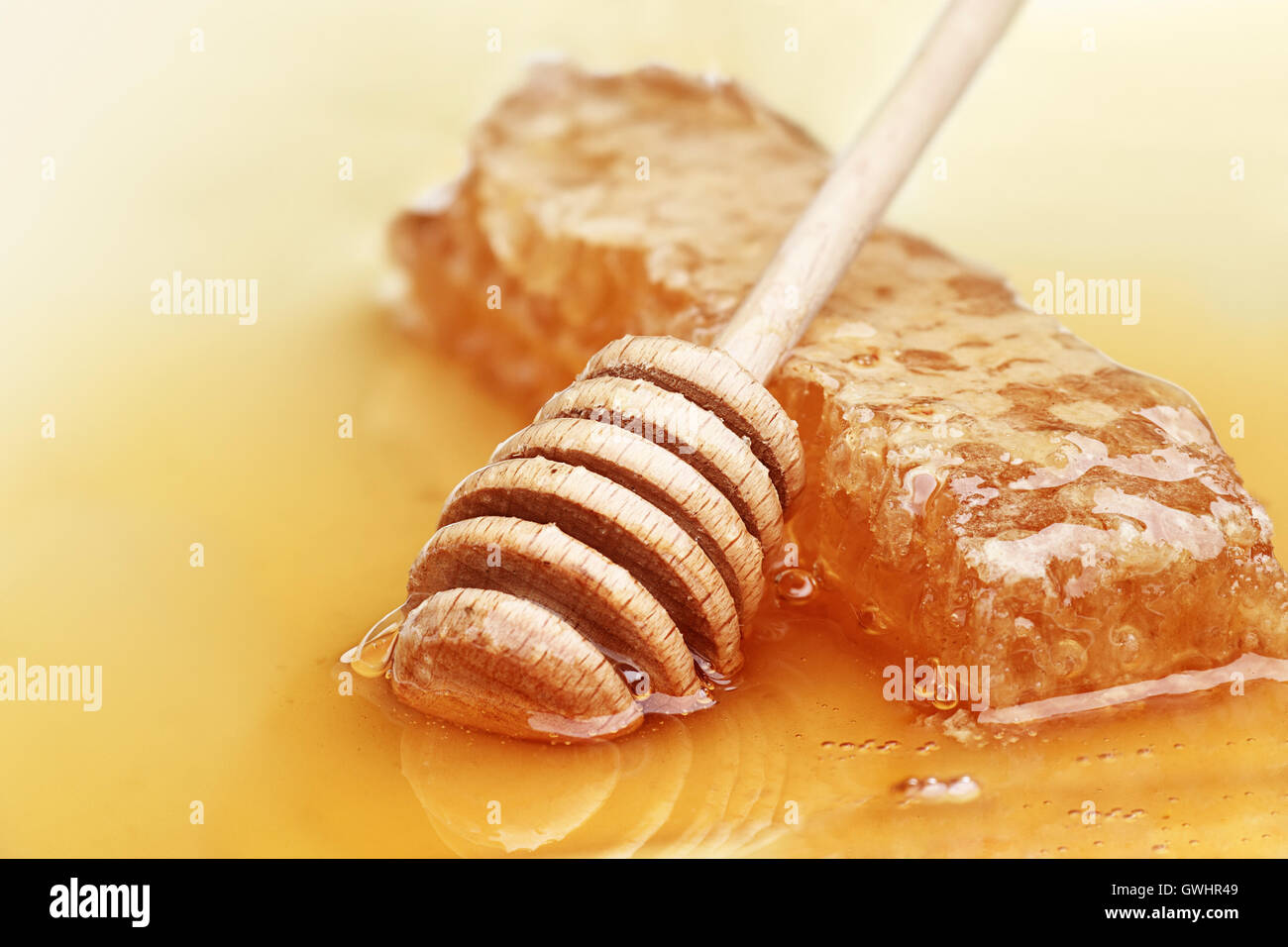 Honey Comb and Dipper Stock Photo - Alamy