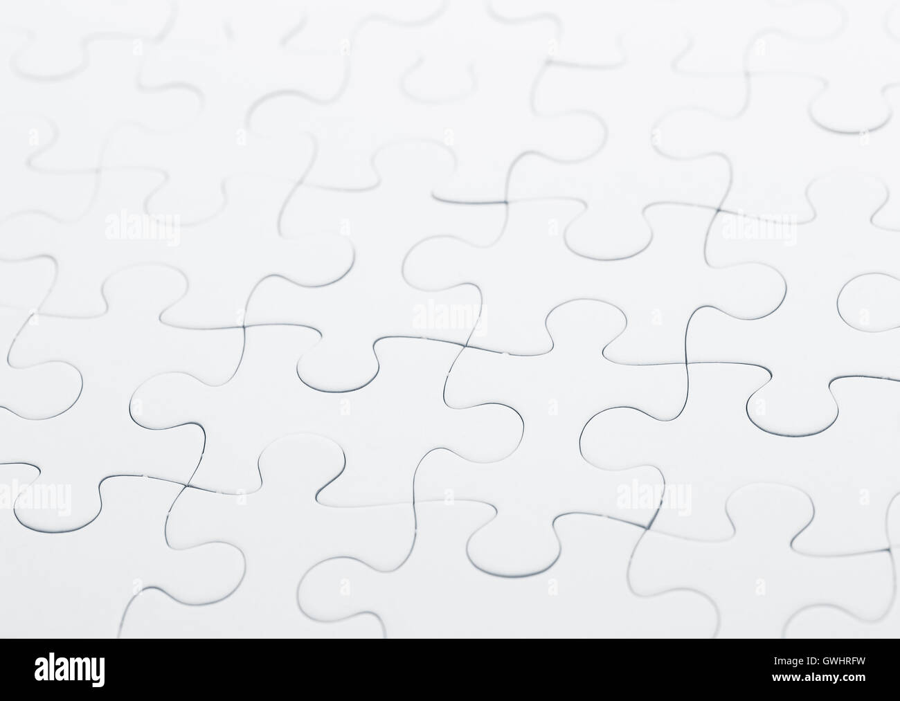 Complete white puzzle Stock Photo - Alamy