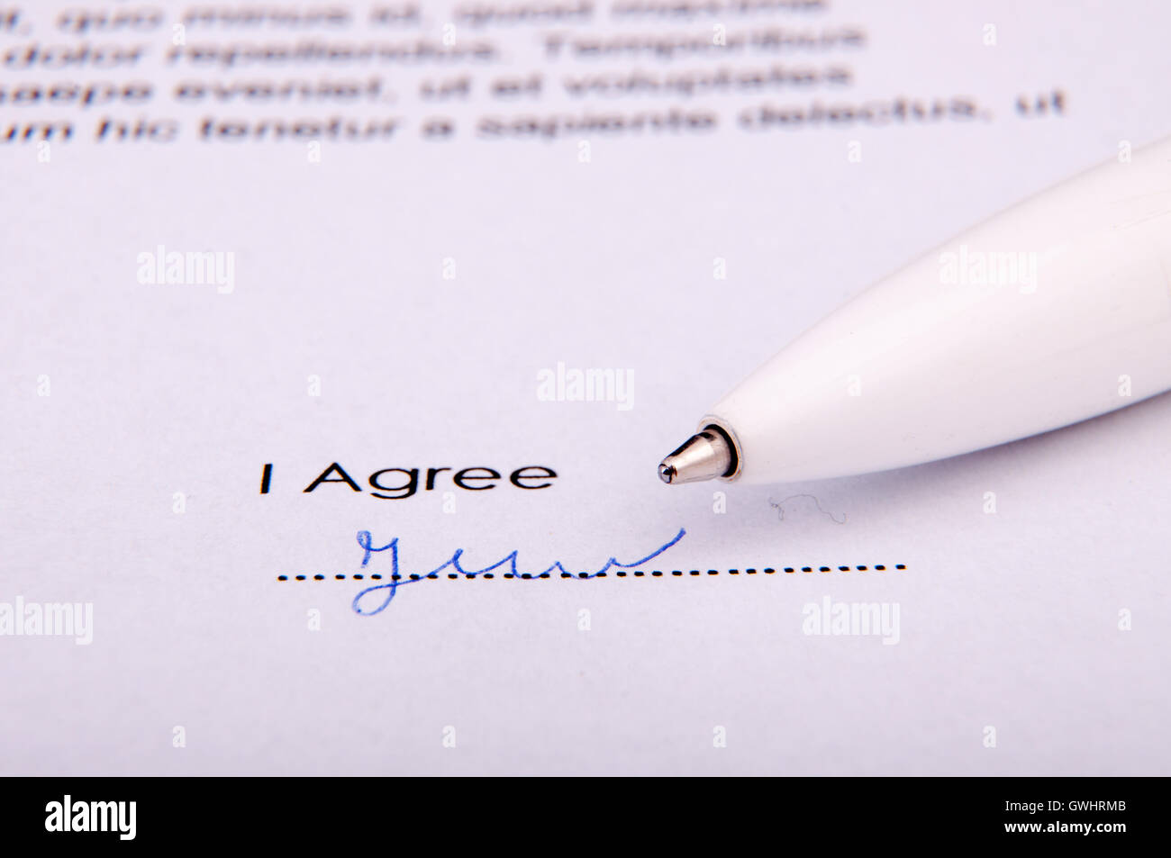 Signature over agreement Stock Photo - Alamy