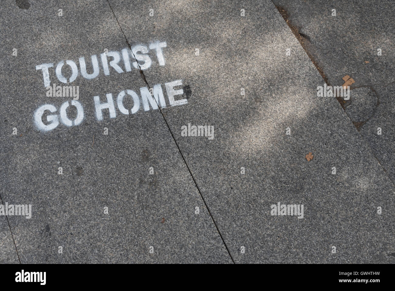 TOURIST GO HOME protest sprayed on the pavements of Barcelona, Spain ...