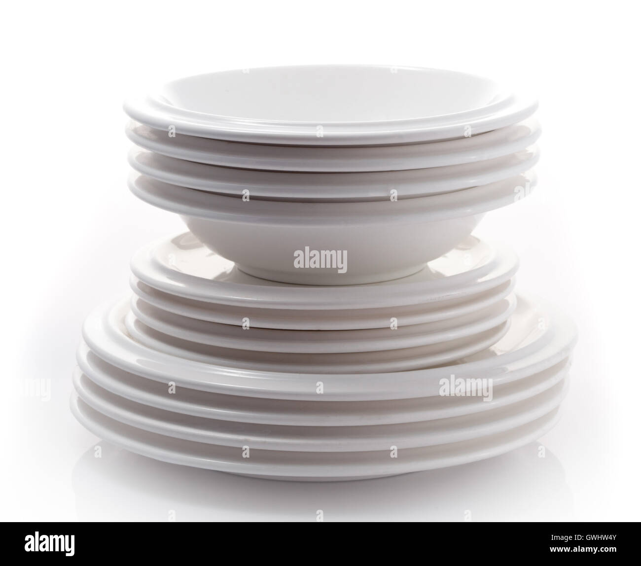 stacks of plates isolated on a white background Stock Photo - Alamy