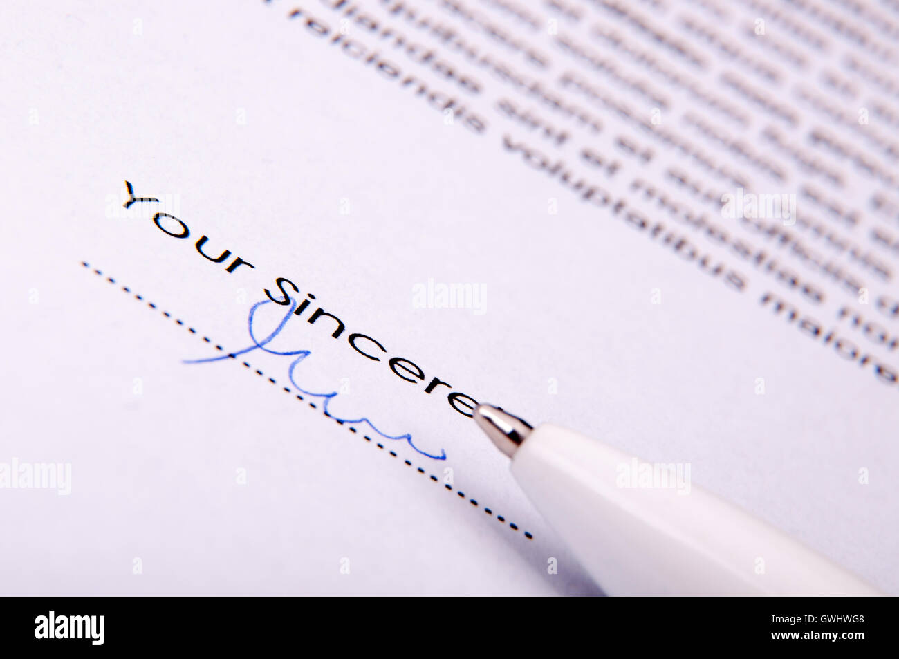 Signature over agreement Stock Photo - Alamy