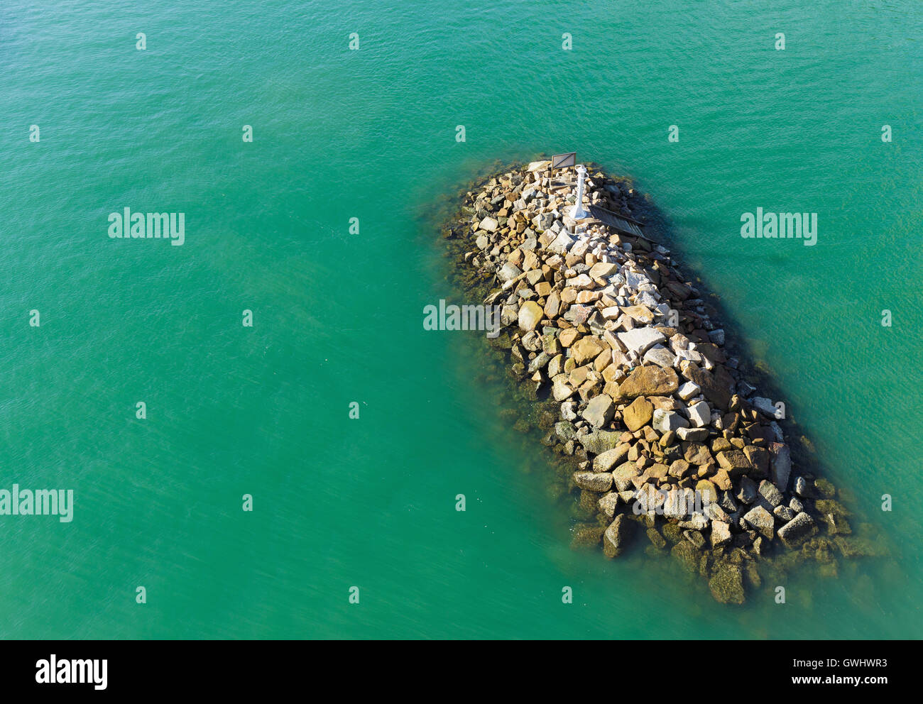 Wave breaker stone Stock Photo - Alamy