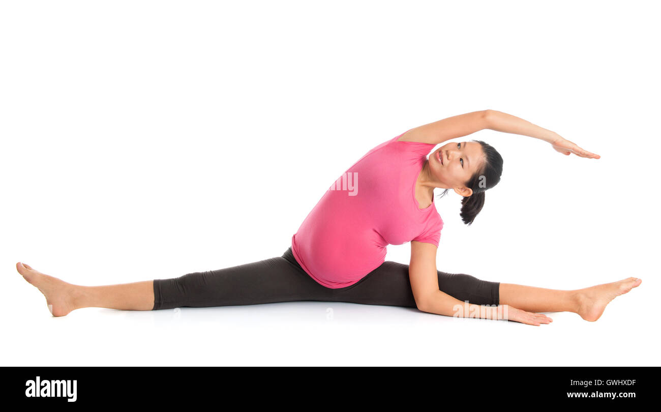 Pregnant woman yoga pose Stock Photo - Alamy