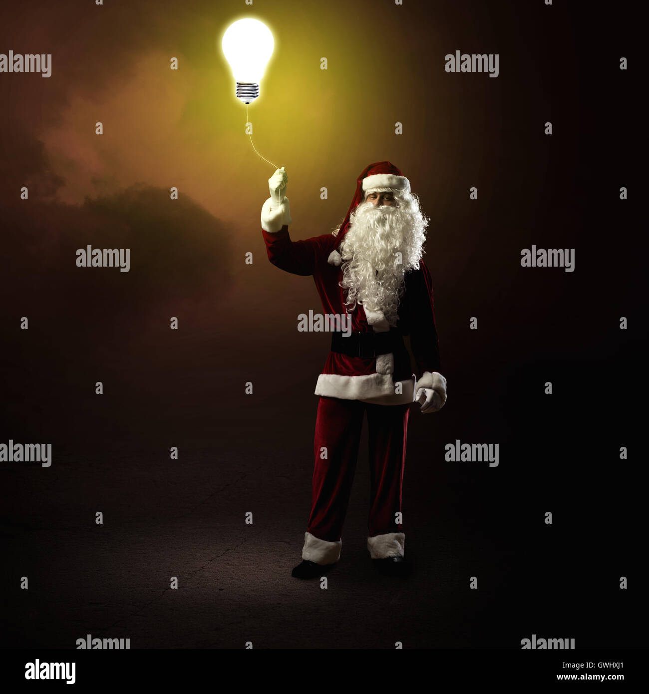 Santa claus holding shining lamp hi-res stock photography and images ...