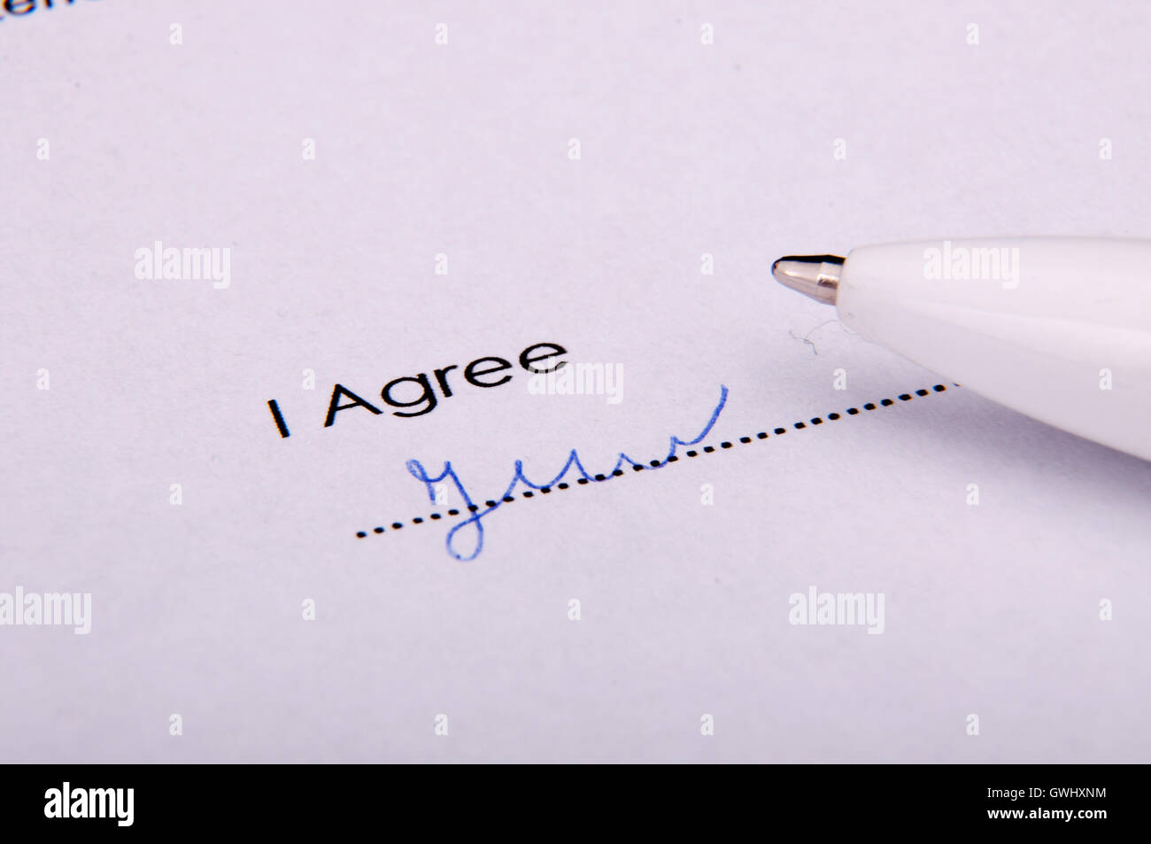 Signature over agreement Stock Photo - Alamy
