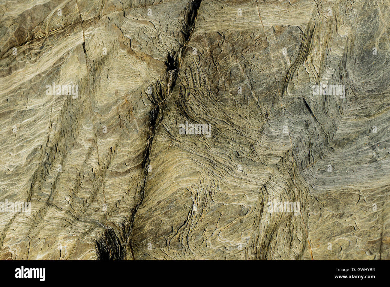 Closeup view of marks, lines and patterns in the eroded surface rock ...