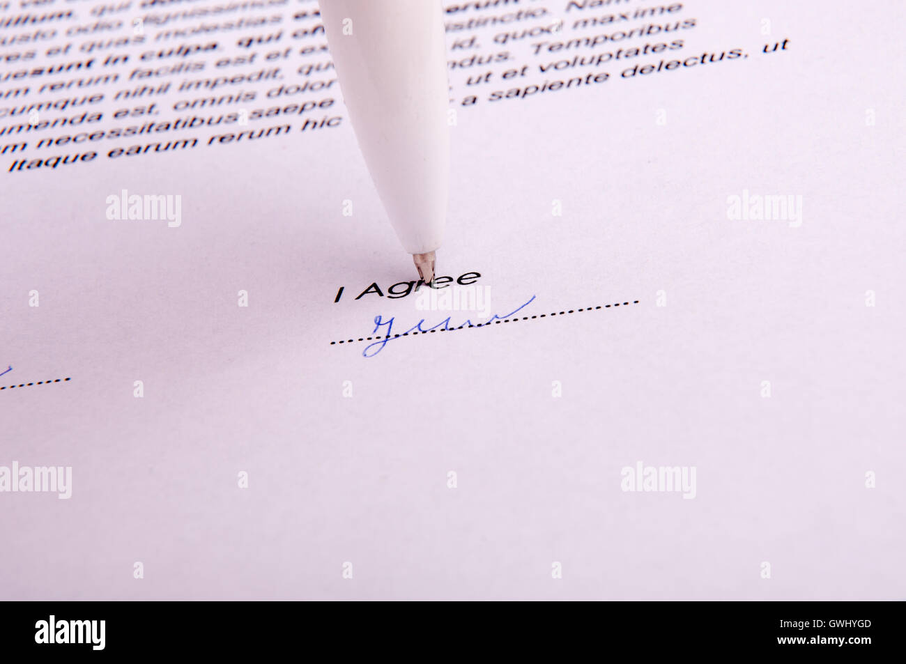 Signature over agreement Stock Photo - Alamy