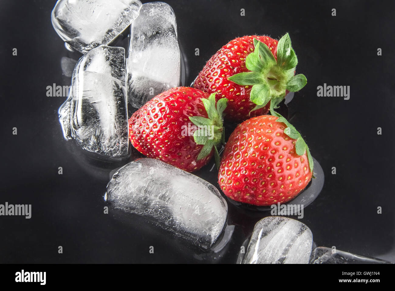 Strawberries with ice Stock Photo - Alamy