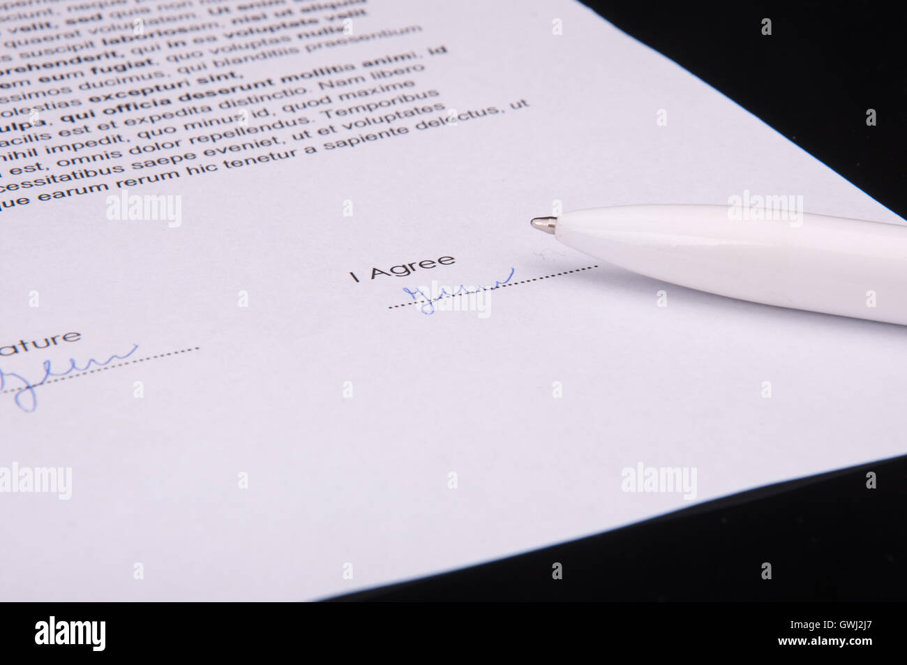 Signature over agreement Stock Photo - Alamy