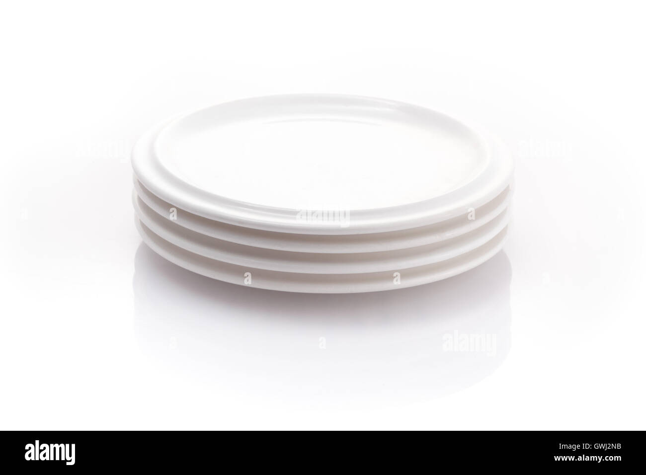 stack of plates isolated on a white background Stock Photo - Alamy