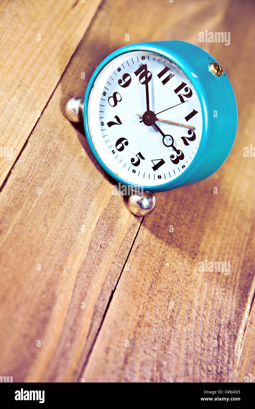 Old clock on the wooden background. Retro vintage picture. Time concept ...