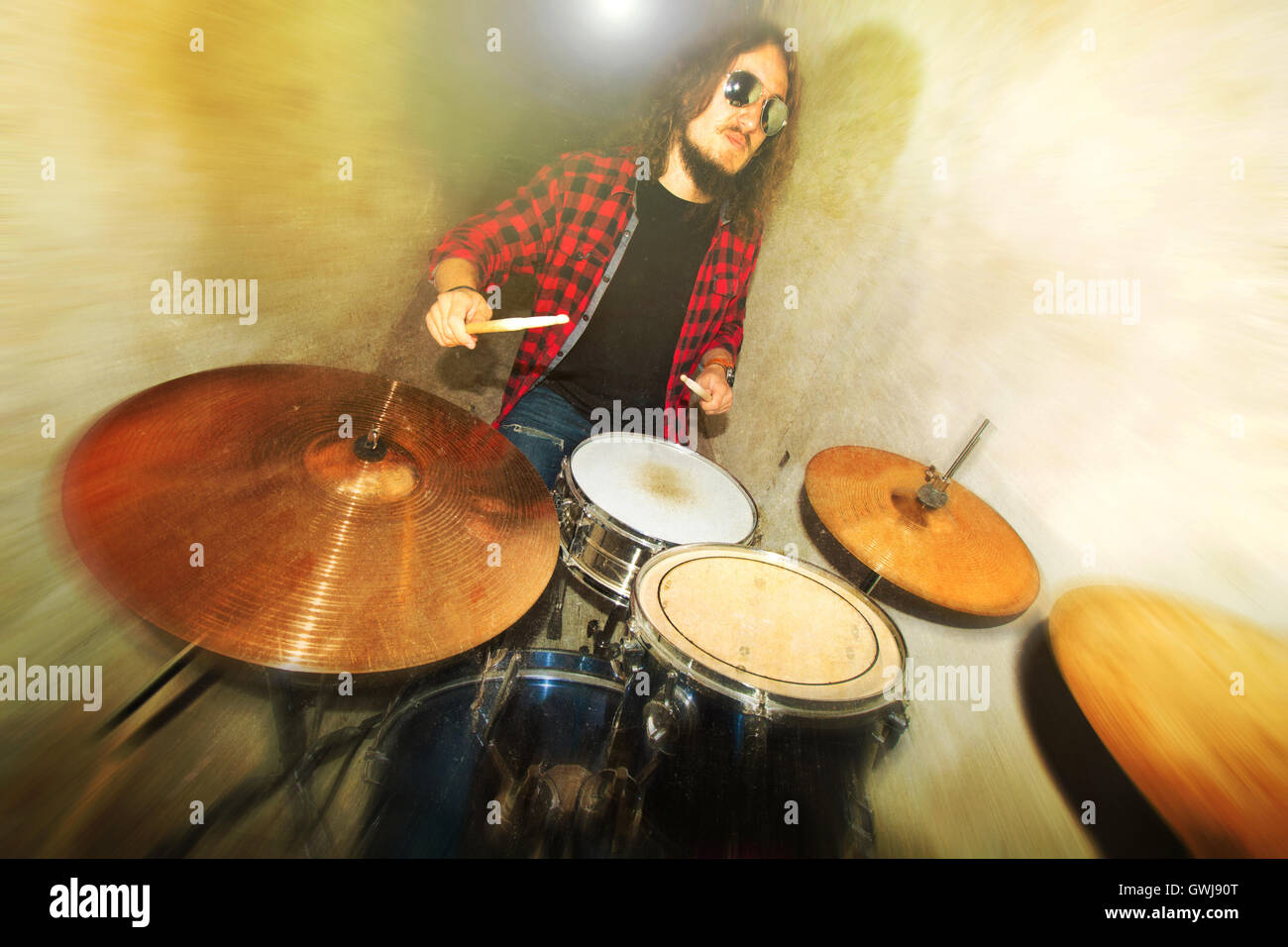 Drums conceptual image. Rock drummer holding drumsticks and playing on ...