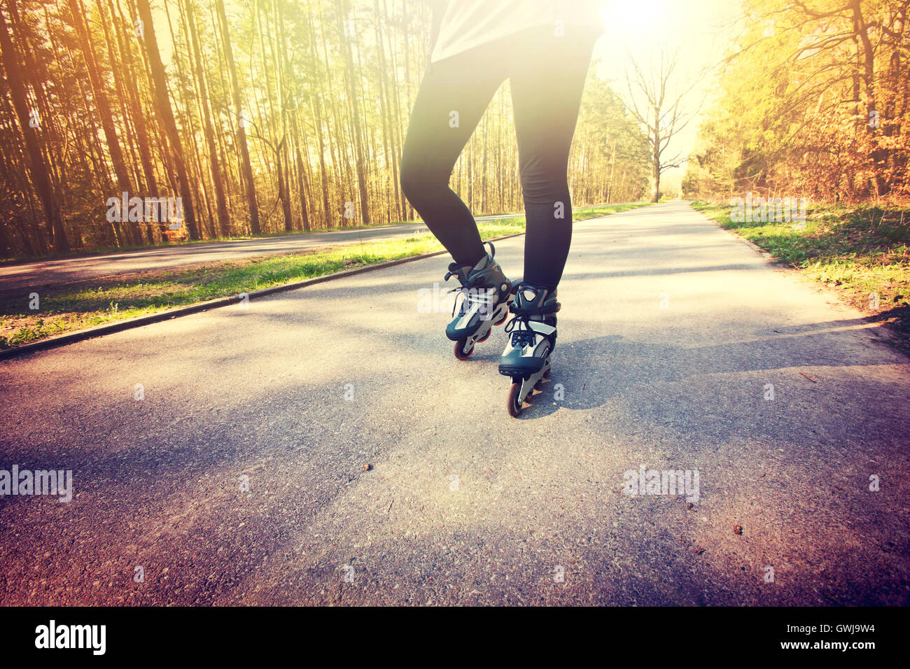 Teenage girl on roller skates at summer. Inline skates sport conceptual ...