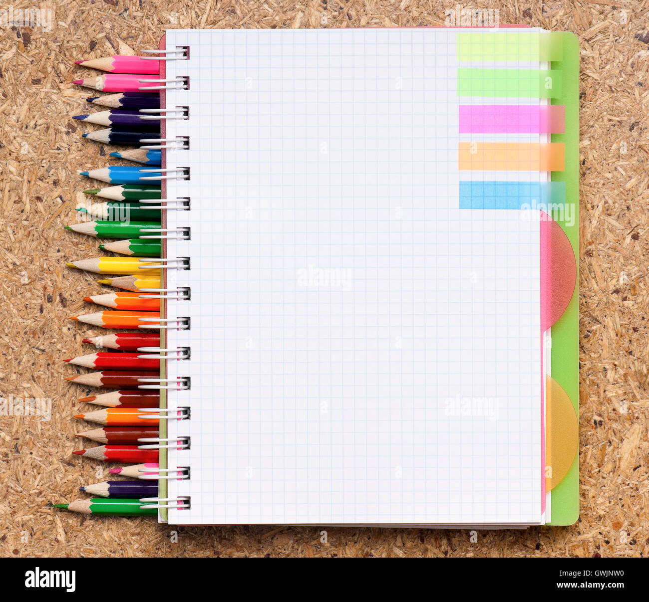 Notebook and colorful pencils Stock Photo - Alamy