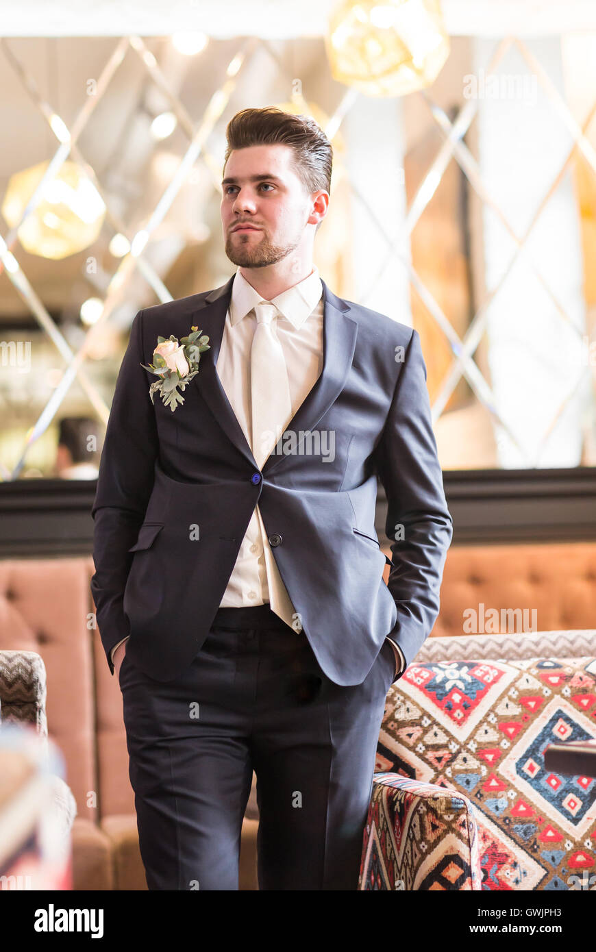 Respectable young man in vintage interior Stock Photo - Alamy