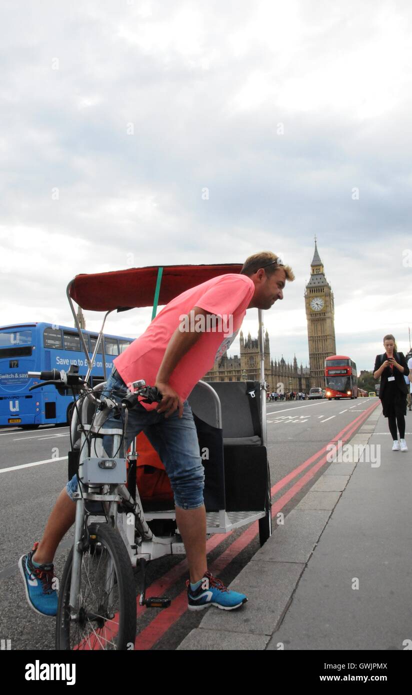 A London Pedicab driver on Westminster Bridge Stock Photo - Alamy
