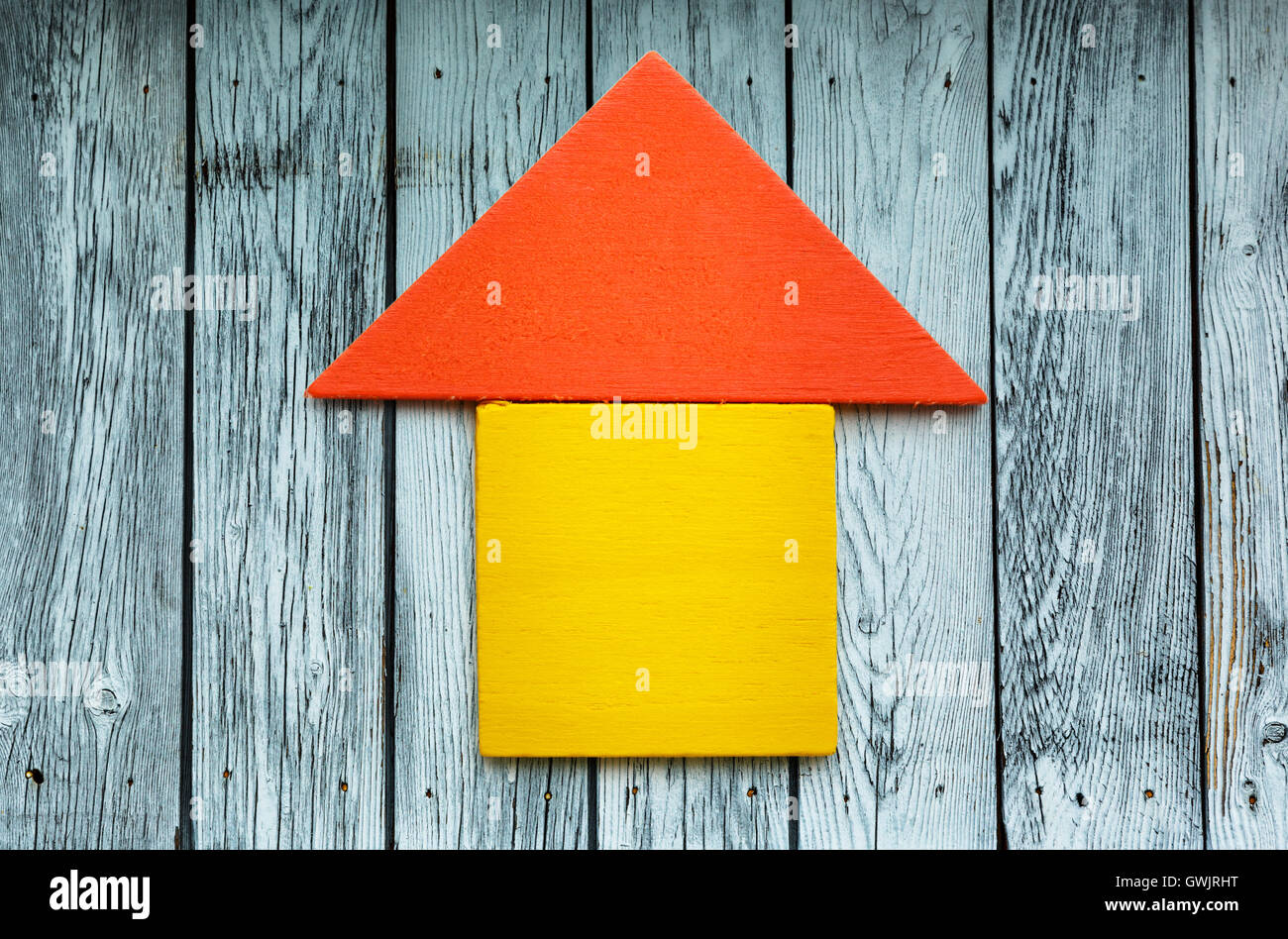 Little wooden house made of toy blocks Stock Photo - Alamy