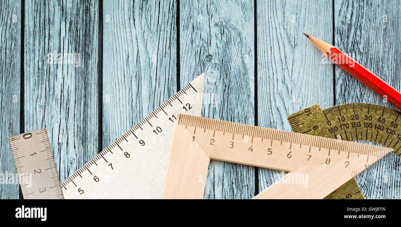 Drafting tools on wooden background closeup Stock Photo - Alamy