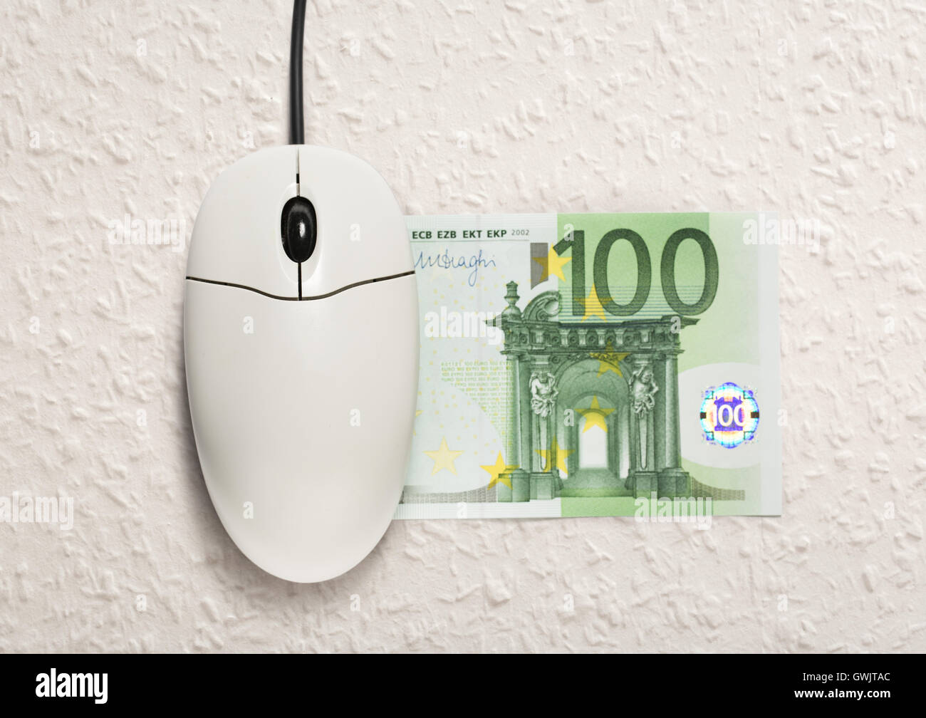 Computer mouse and one hundred euro banknote on wall Stock Photo - Alamy