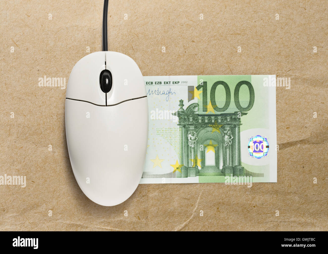 Computer mouse and one hundred euro banknote on paper Stock Photo - Alamy