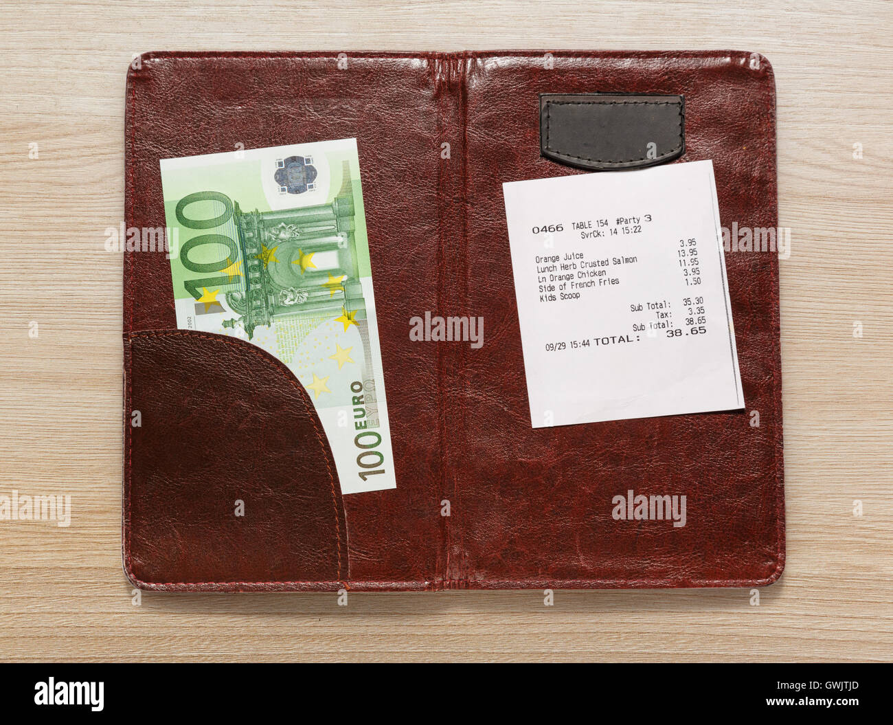 Open check folder with bill and euro banknotes Stock Photo - Alamy