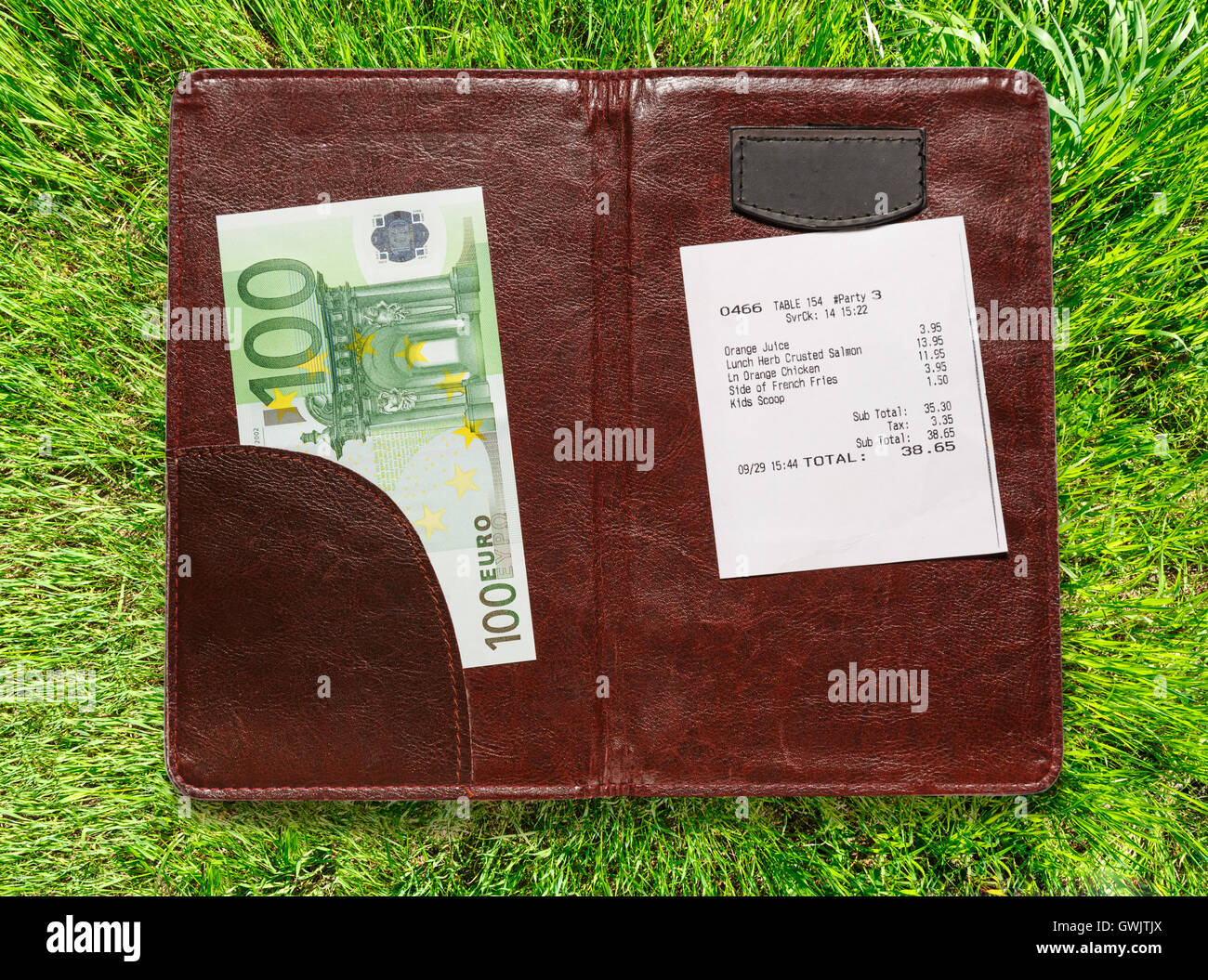 Open check folder with bill and euro banknotes Stock Photo - Alamy