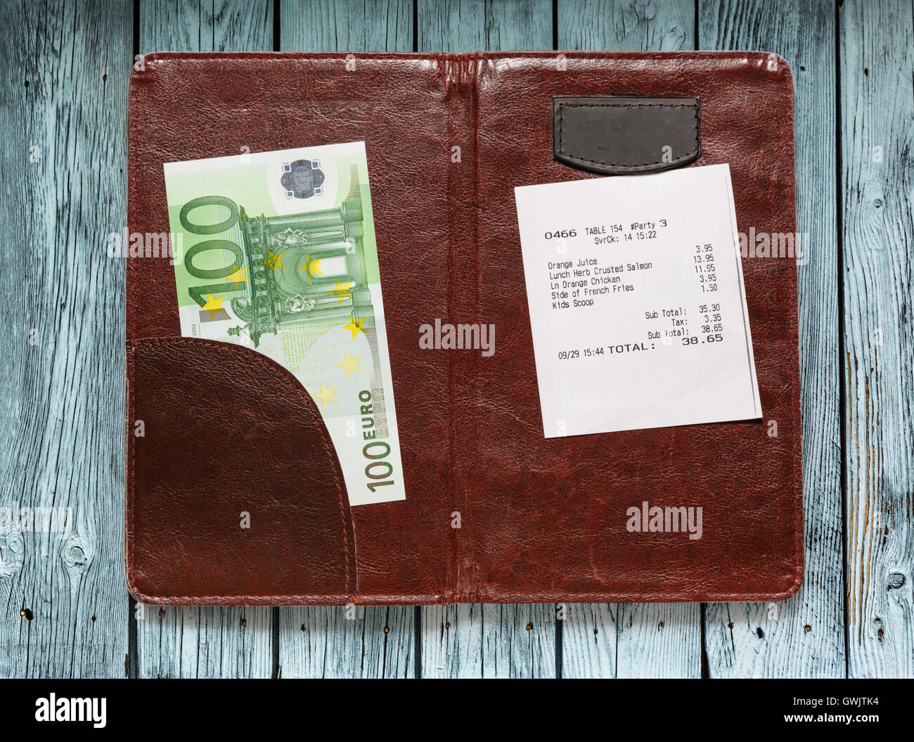 Open check folder with bill and euro banknotes Stock Photo - Alamy