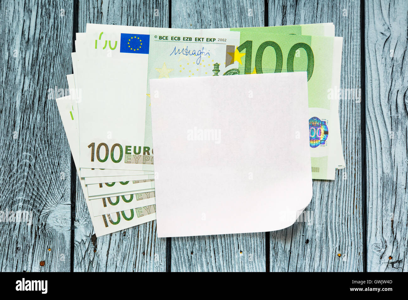 One hundred euro banknotes and blank paper Stock Photo - Alamy