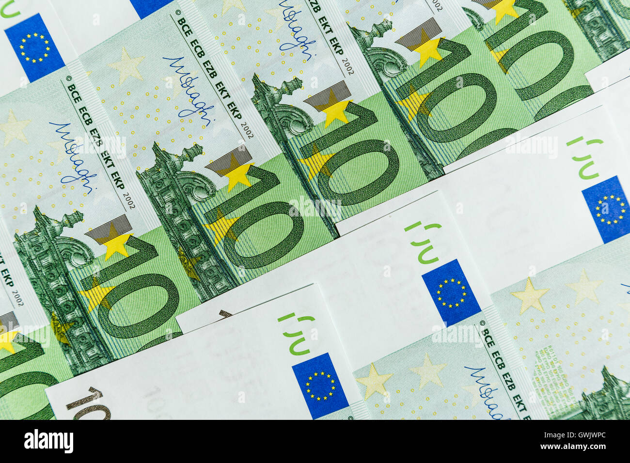 One hundred euro banknotes in closeup as background Stock Photo - Alamy