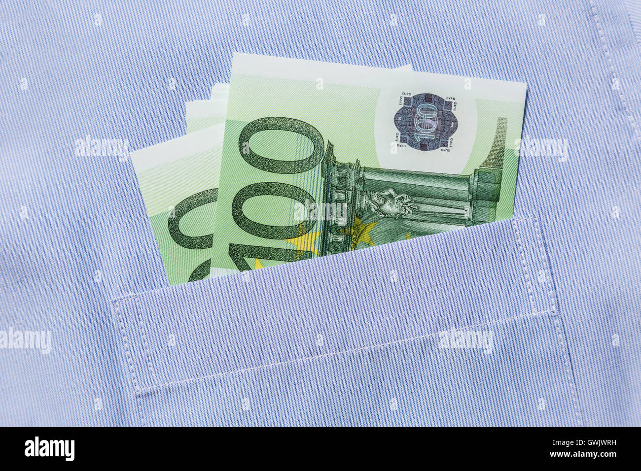 One hundred euro banknotes in shirt pocket Stock Photo - Alamy