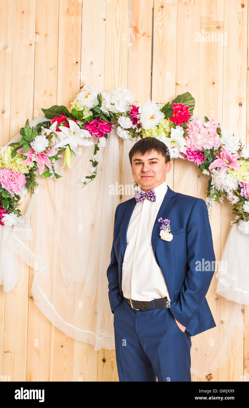 Respectable young man in interior Stock Photo - Alamy