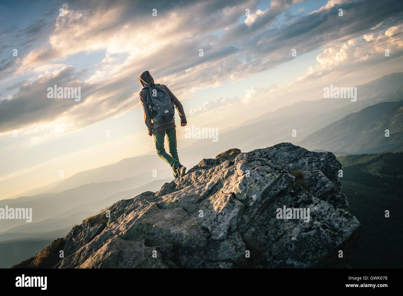 Man Standing On A Rock Stock Photo - Alamy