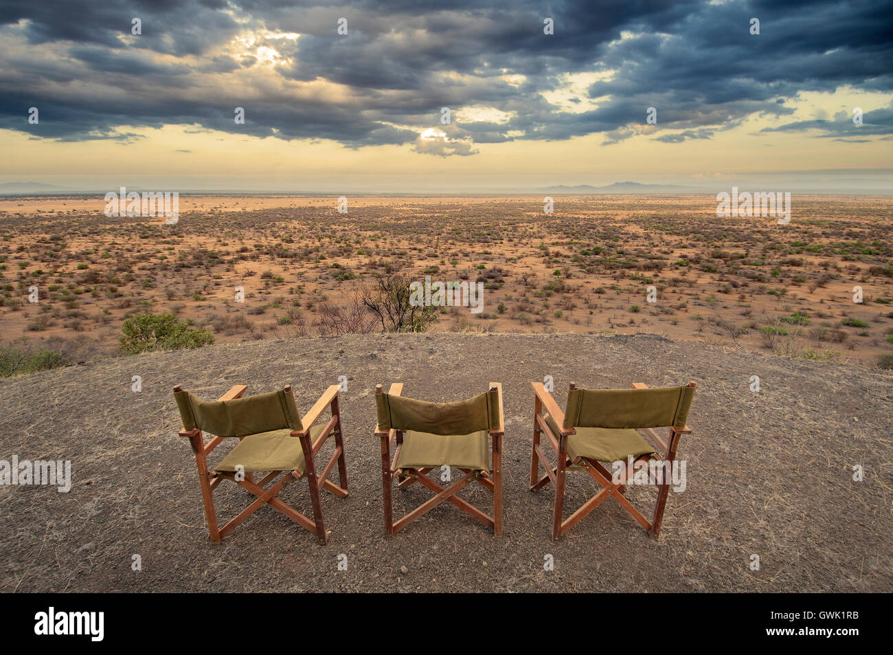 Chairs on a cliff overlooking Africa Savannah. Landscape Stock Photo ...