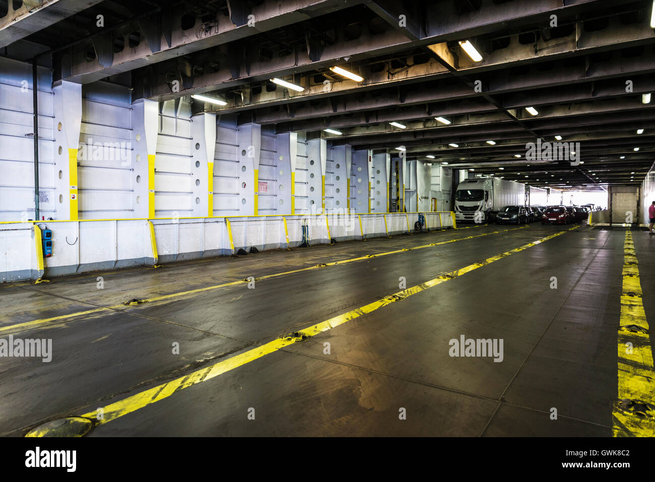 Car deck with cars and trucks on a ferry sailing the Mediterranean Sea ...