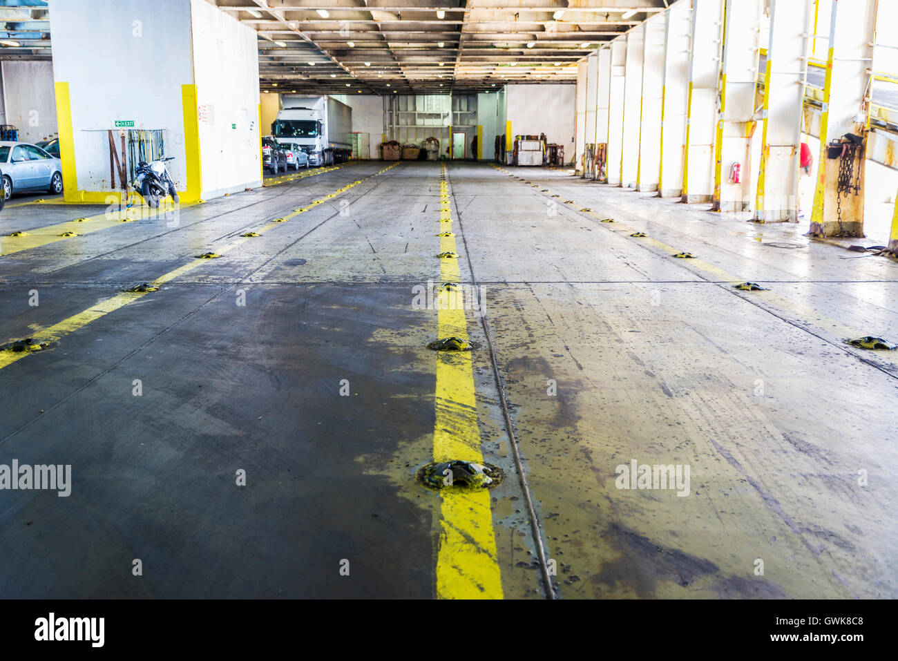 Car deck with cars and trucks on a ferry sailing the Mediterranean Sea ...