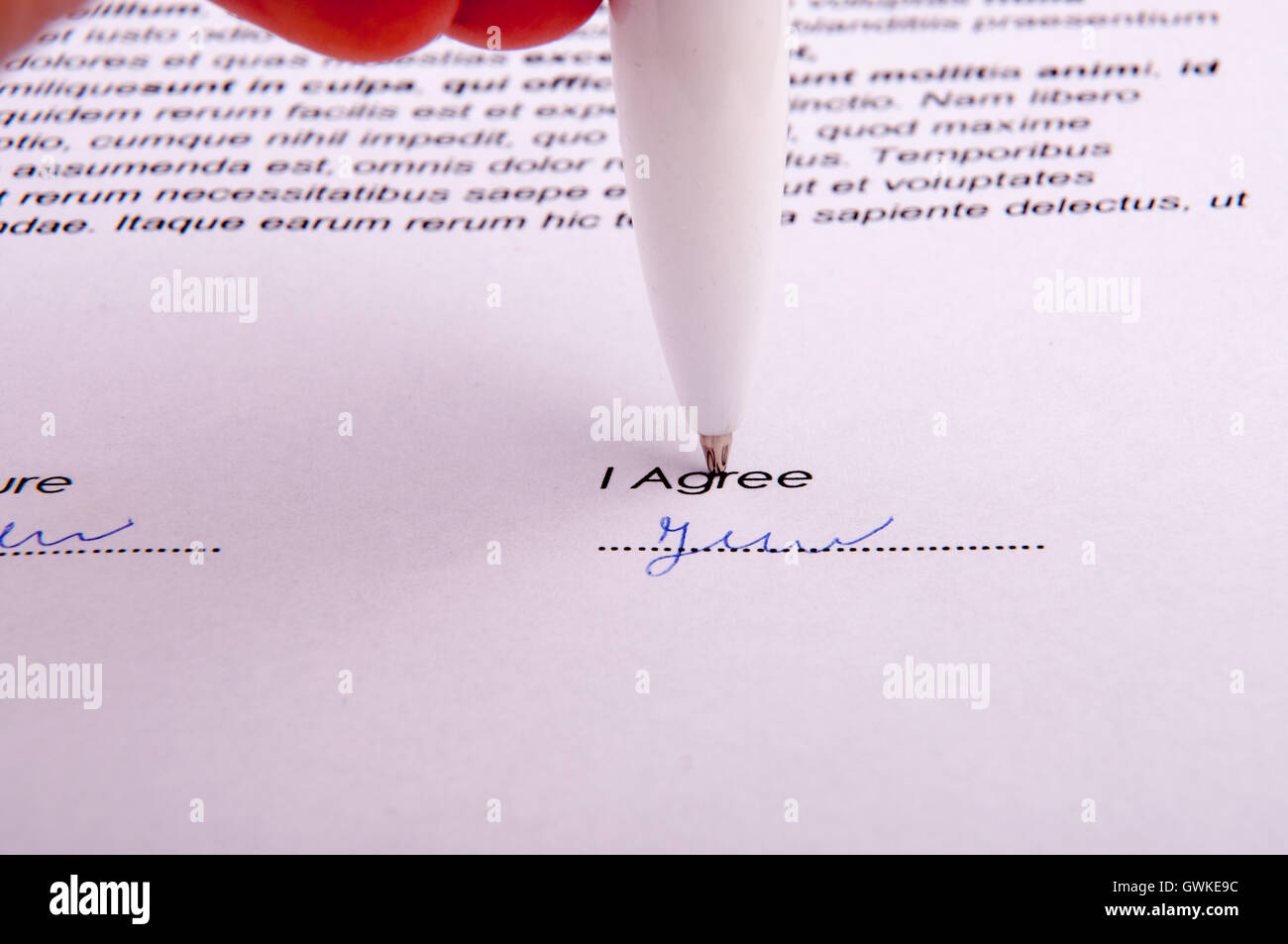 Signature over agreement Stock Photo - Alamy