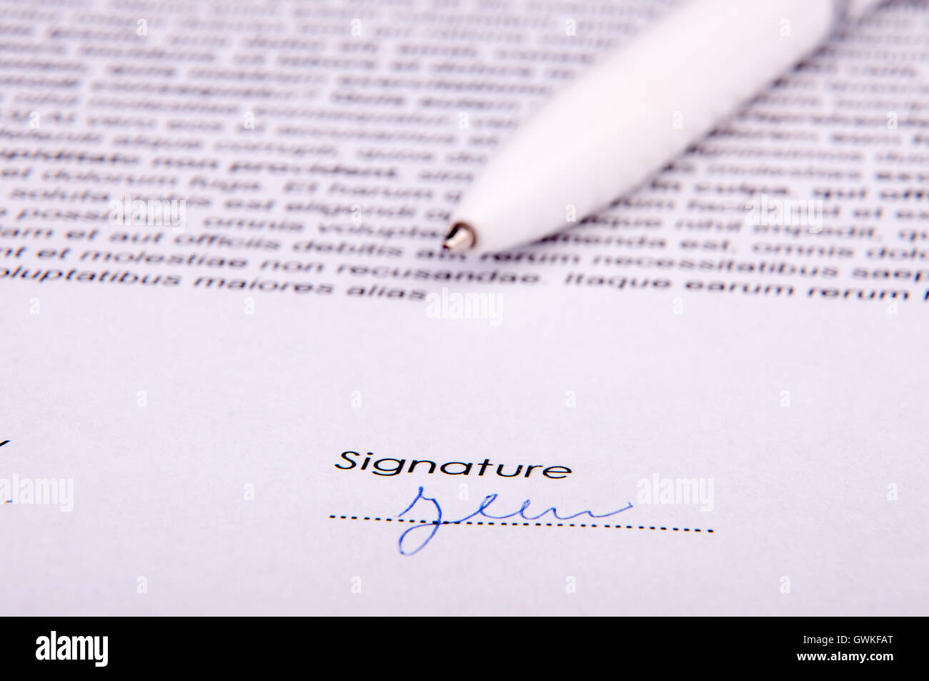 Signature over agreement Stock Photo - Alamy