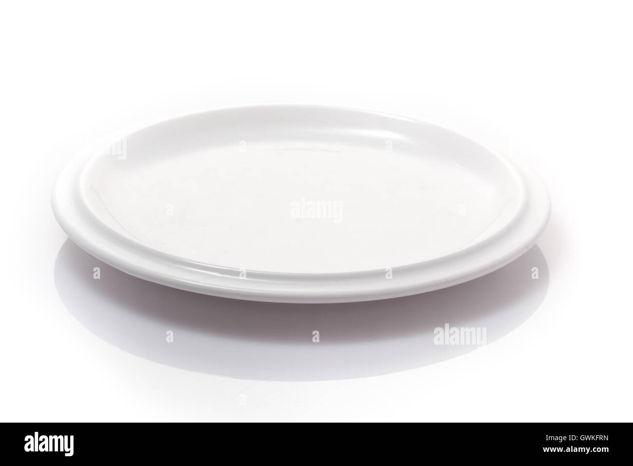 one round china plate isolated on a white background Stock Photo - Alamy