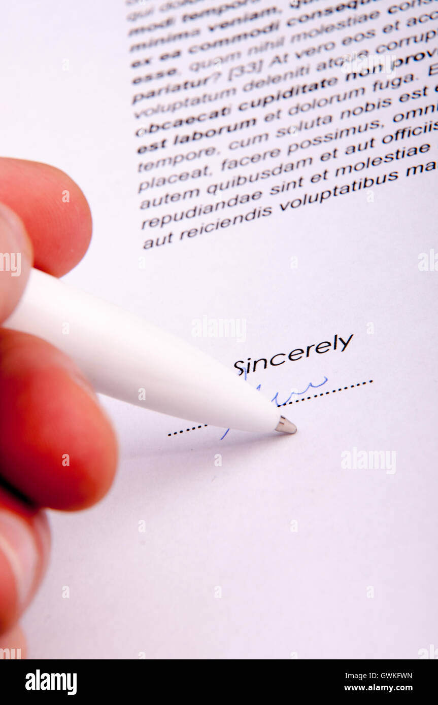 Signature over agreement Stock Photo - Alamy