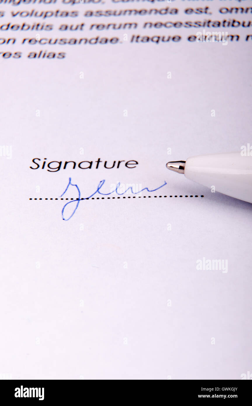Signature over agreement Stock Photo - Alamy