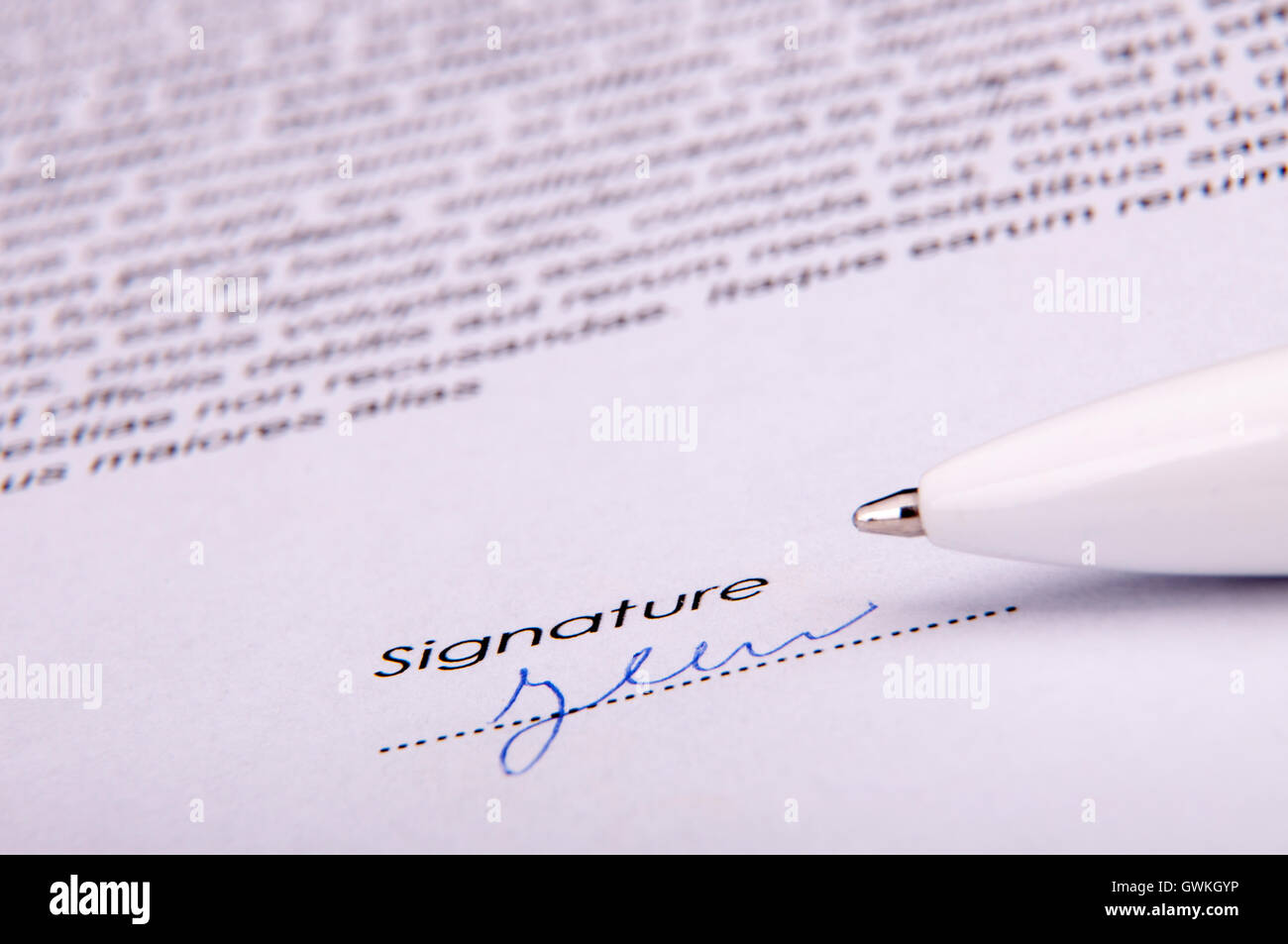 Signature over agreement Stock Photo - Alamy
